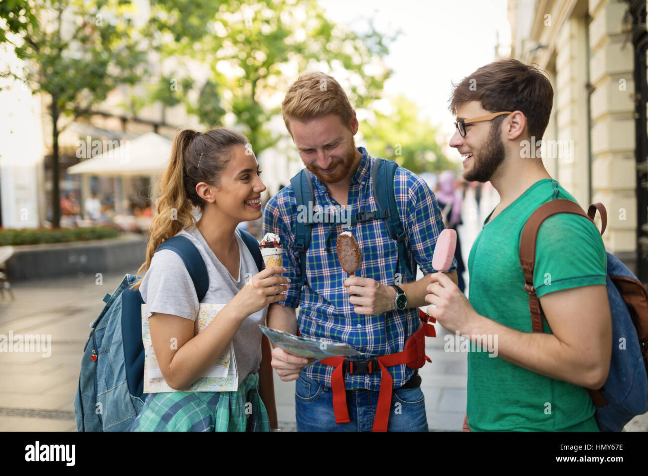 Happy young cute tourists traveling and sightseeing city Stock Photo ...