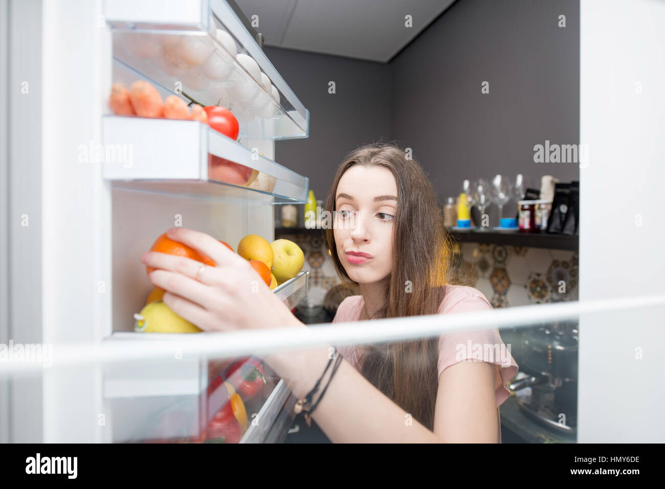 Woman taking food from the refrigerator. View from the inside Stock ...