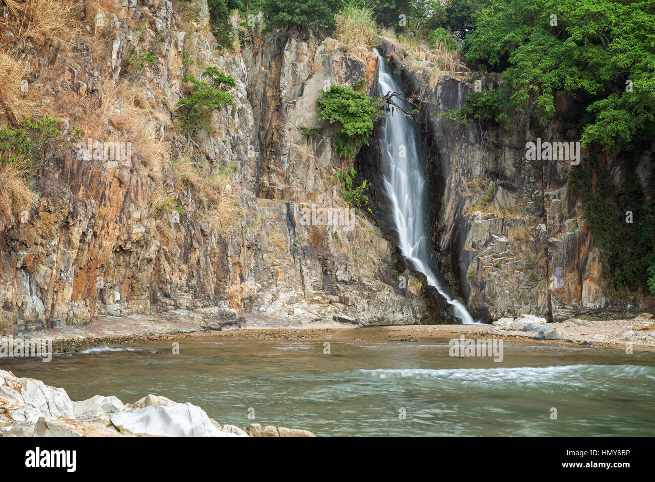 Bay, steep cliff and a waterfall at the Waterfall Bay Park in Hong Kong ...