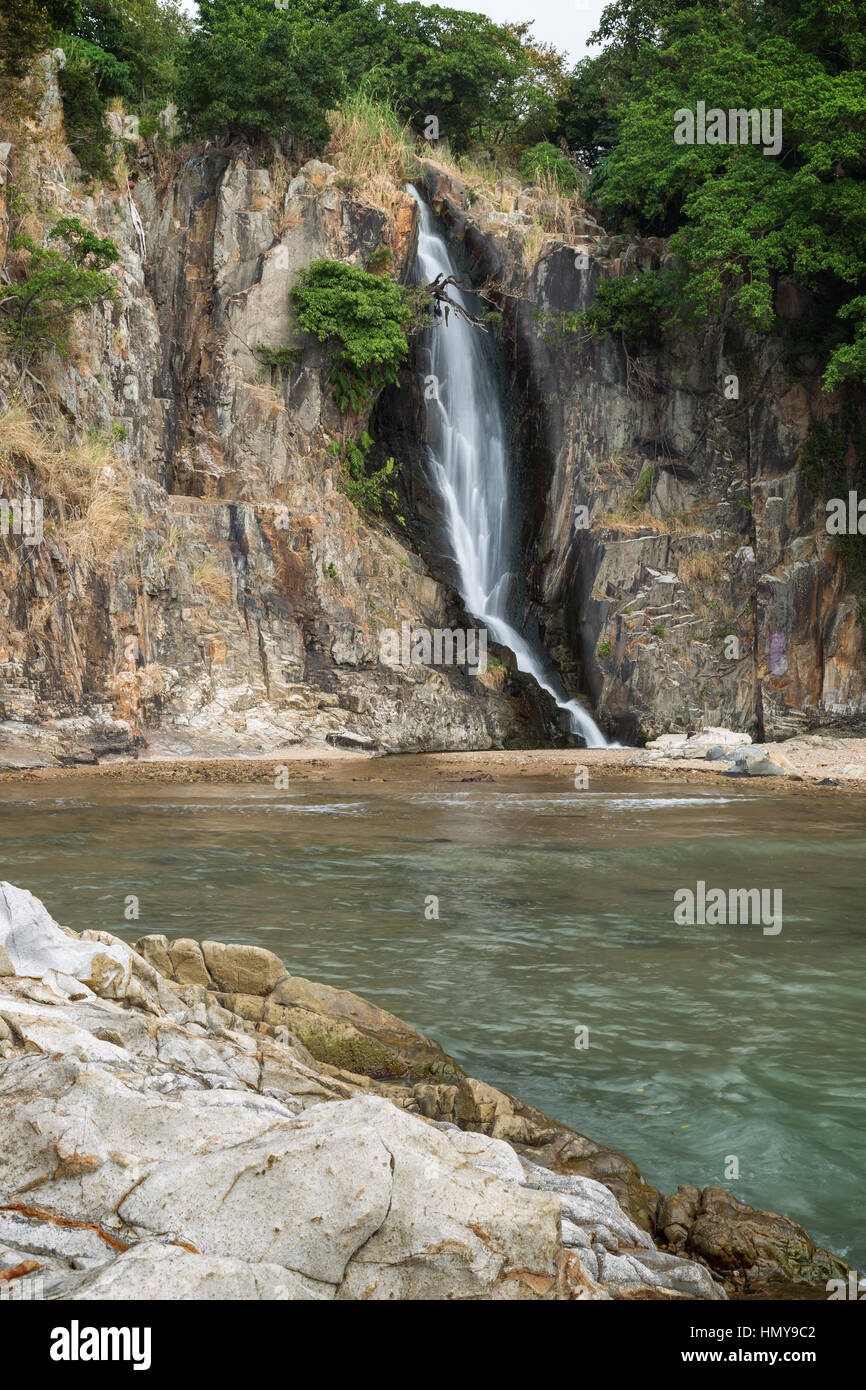 Bay, steep cliff and a waterfall at the Waterfall Bay Park in Hong Kong ...