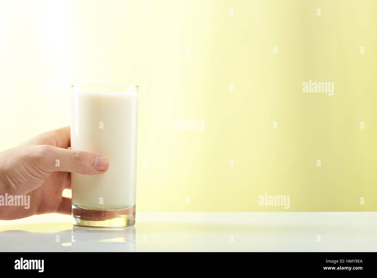 Hand holding glass of milk hi-res stock photography and images - Alamy