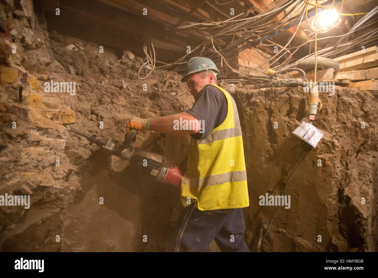 A basement extension is dug out inside a residential terrace house in ...