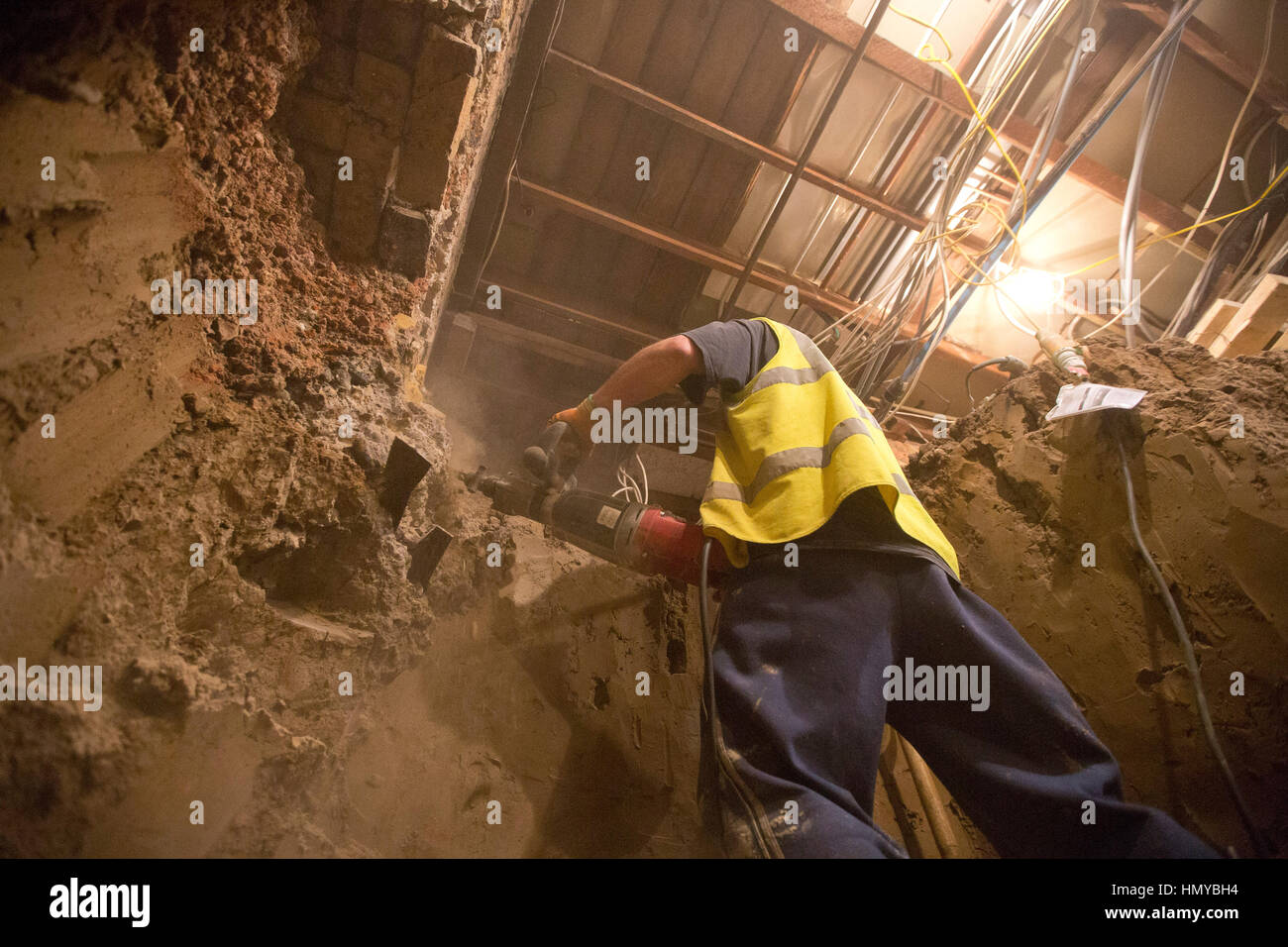 A basement extension is dug out inside a residential terrace house in ...