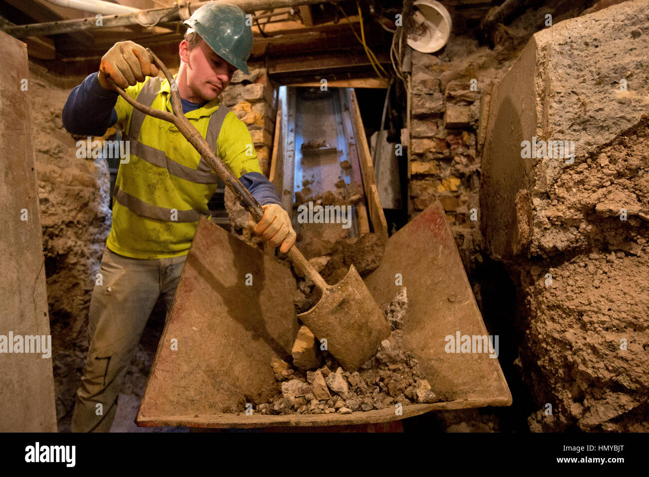 A basement extension is dug out inside a residential terrace house in ...