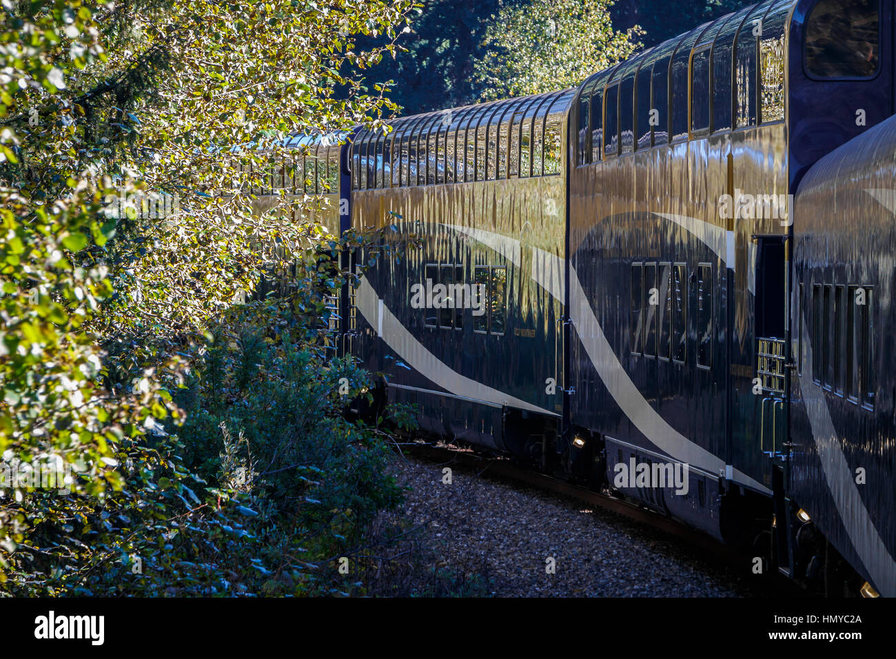 The Rocky Mountaineer railway train winds it's way through Banff ...