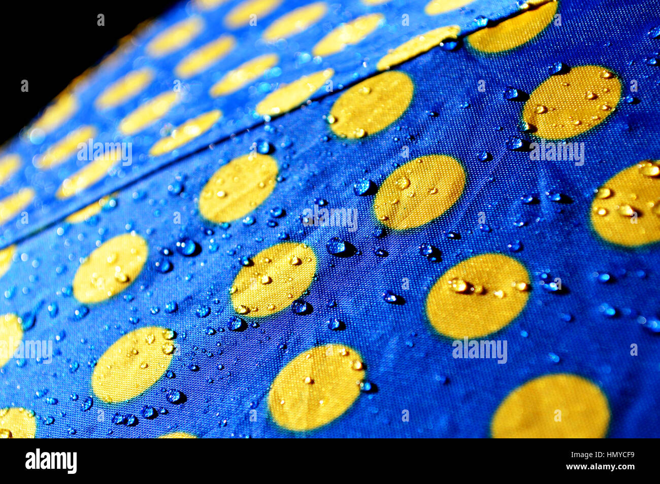 Blue and yellow umbrella hi-res stock photography and images - Alamy