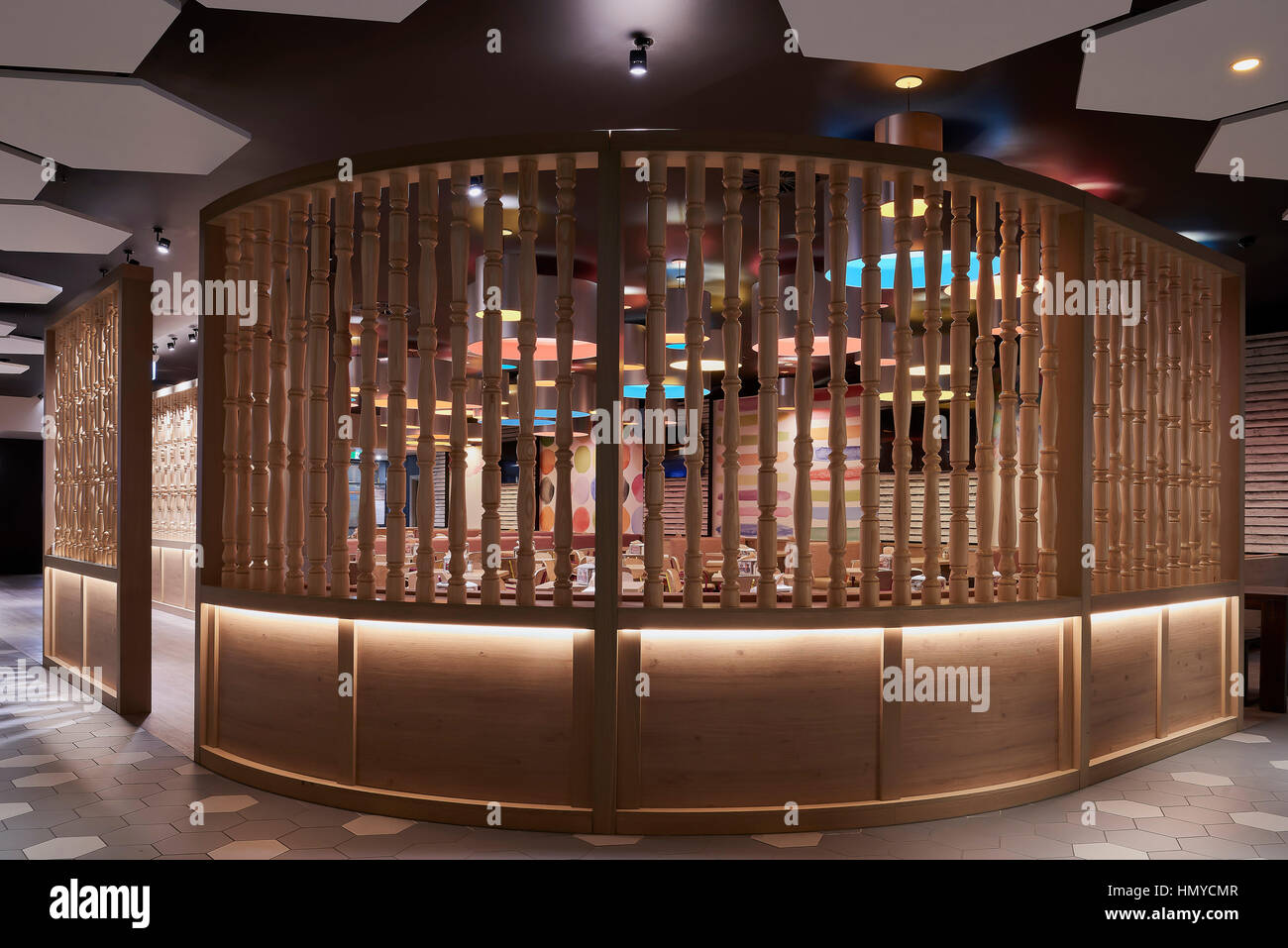 Side view into separate restaurant area with timber screens ...