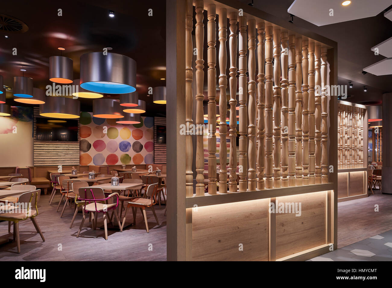 View into separate restaurant area with timber screens and coloured ...
