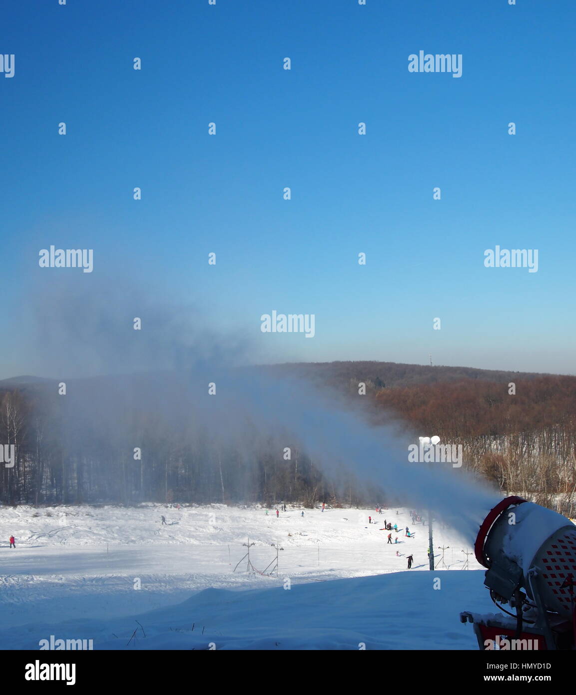 Skiing winter sports and snow gun Stock Photo - Alamy