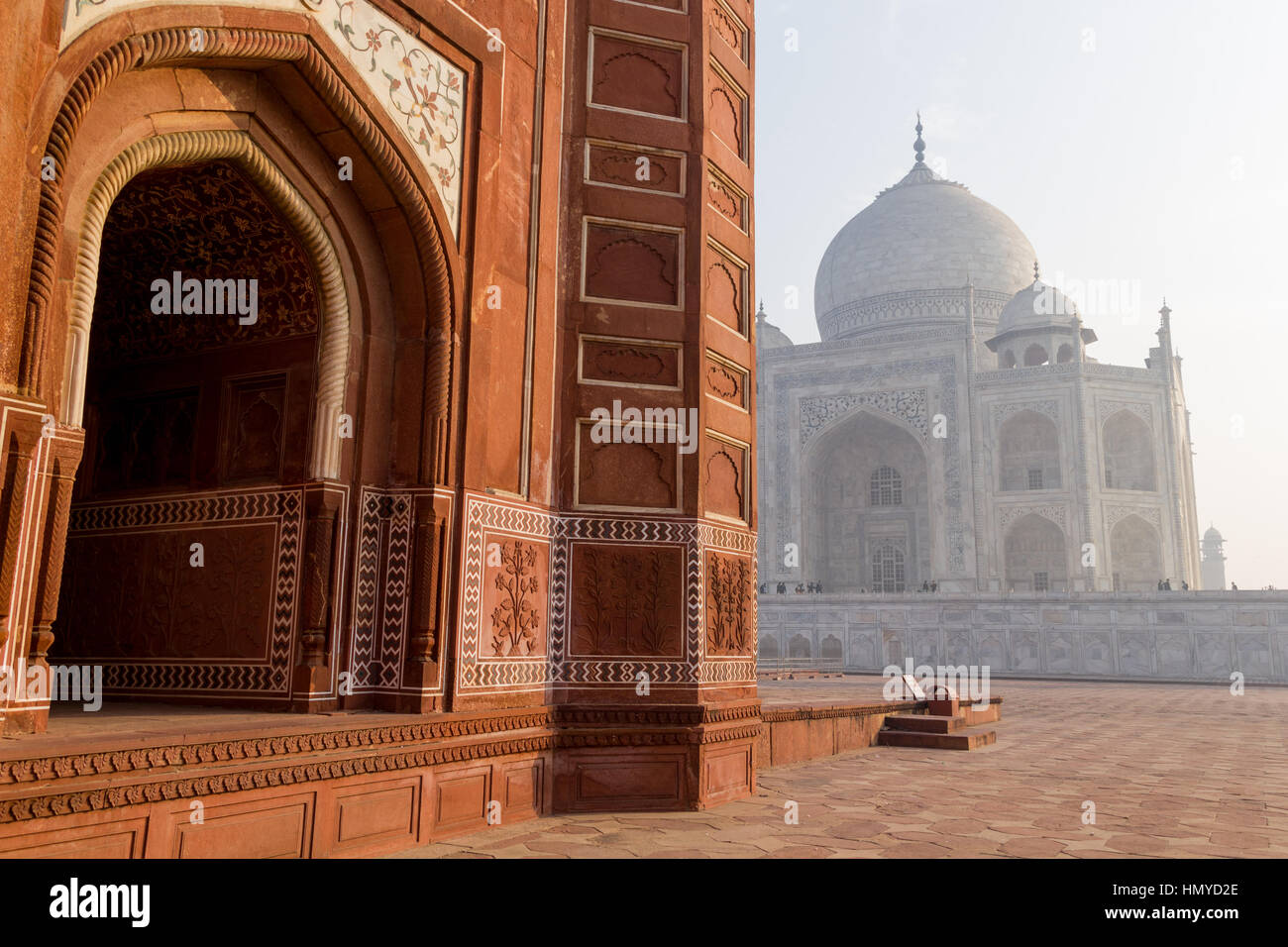 Side view of the Taj Mahal, with the sandstone mosque in the foreground ...