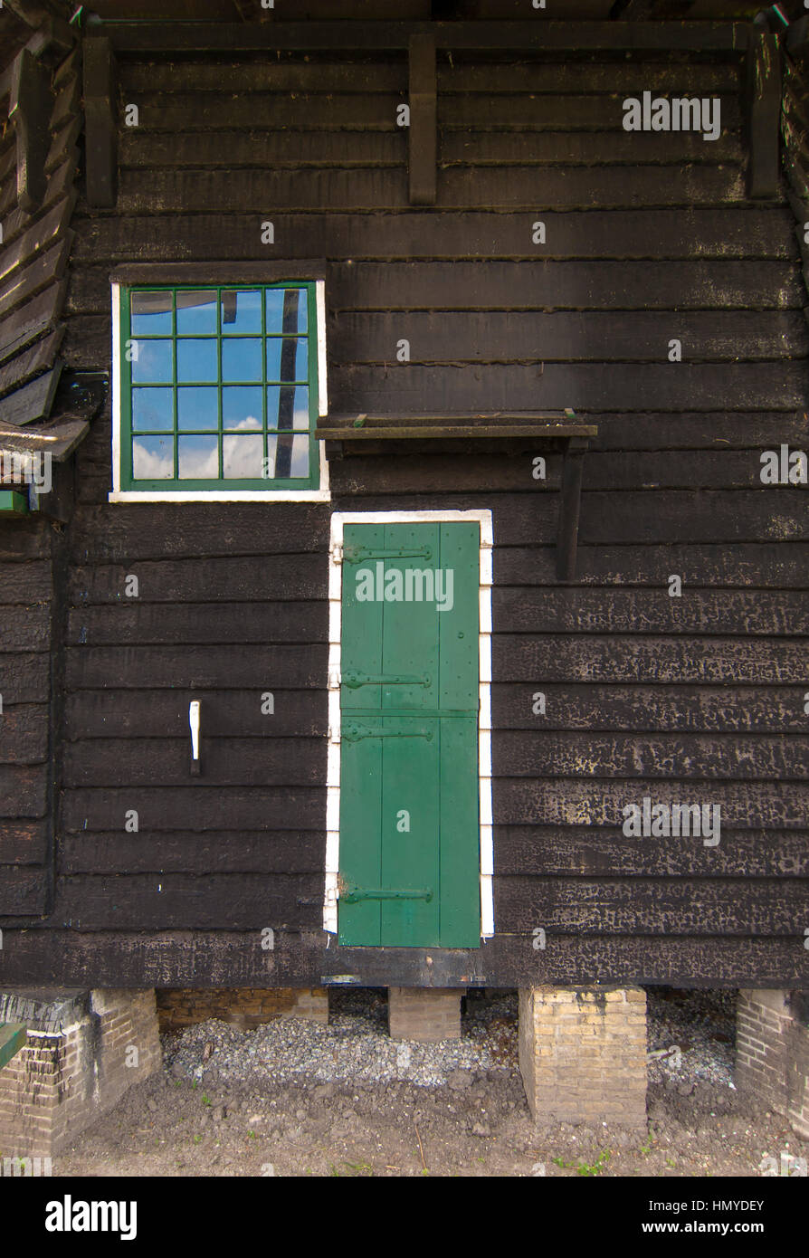 Green door of a windmill Stock Photo - Alamy