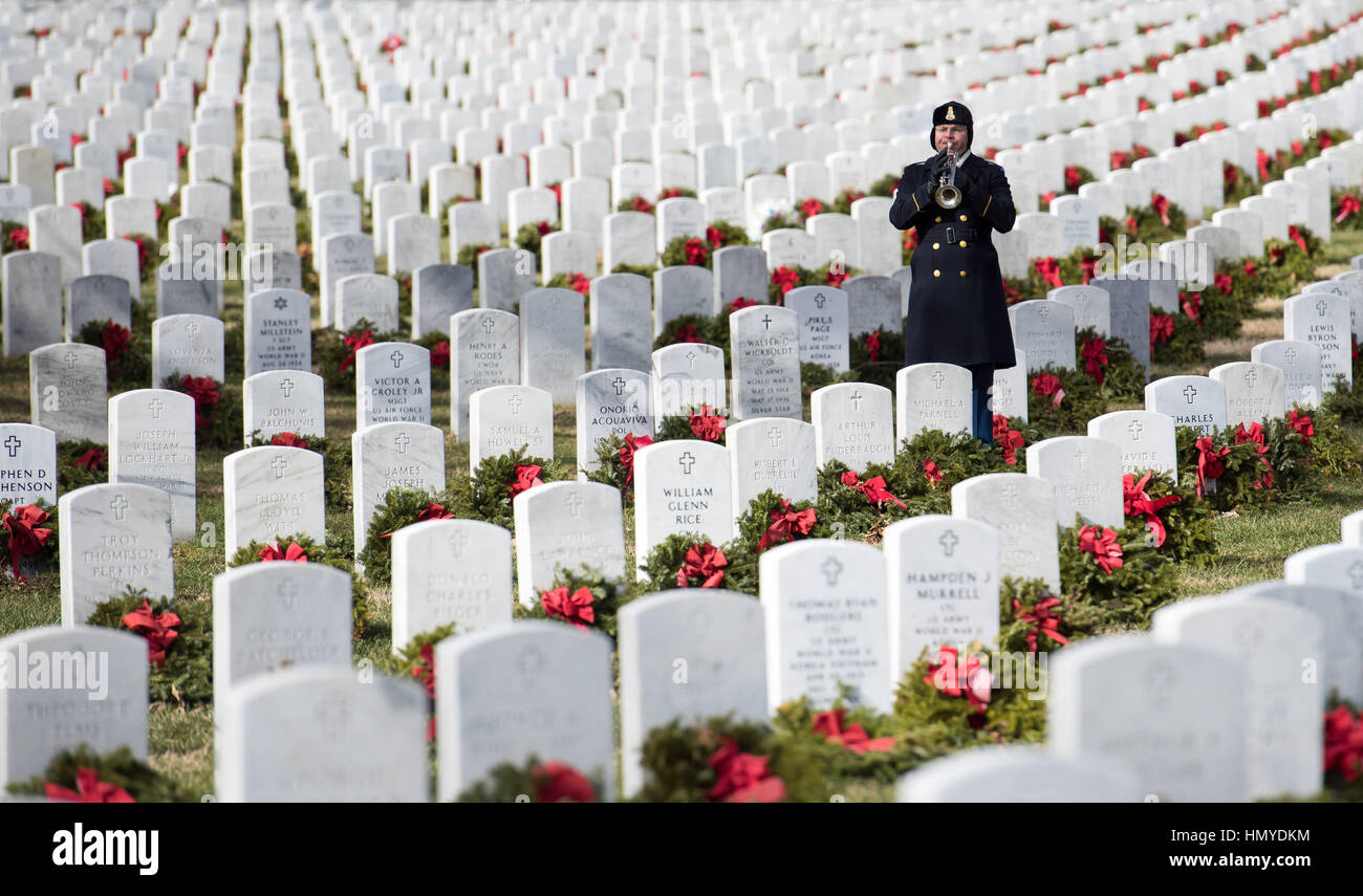 A 3rd Army Old Guard bugler plays Taps during a military honors funeral ...