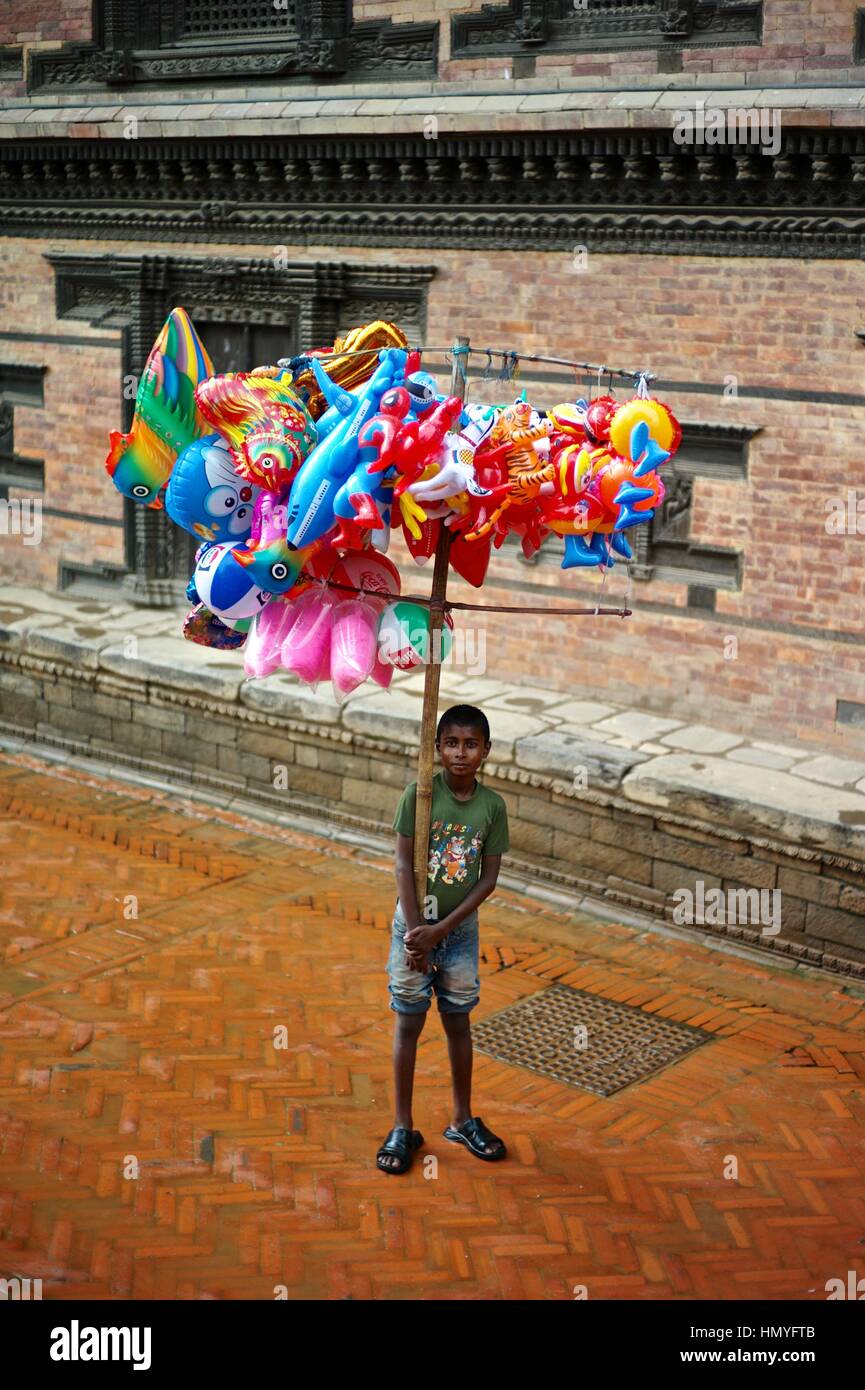 Teen Nepali boy selling balloons in the streets of Bakthapur Stock ...