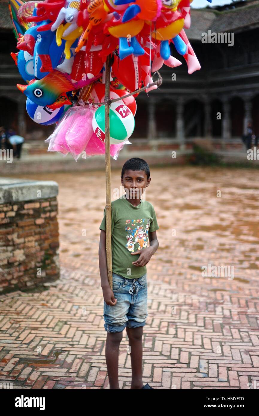 Teen Nepali boy selling balloons in the streets of Bakthapur Stock ...