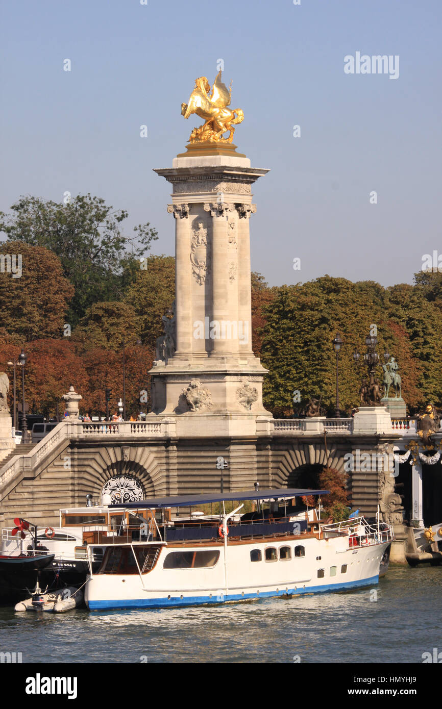 One of the four gilt-bronze statues of Fames watch over the Pont ...