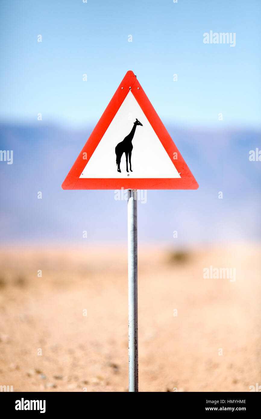 Caution sign in the Namibian desert Stock Photo - Alamy
