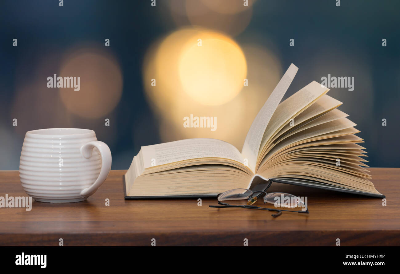 book with cup and glasses Stock Photo - Alamy