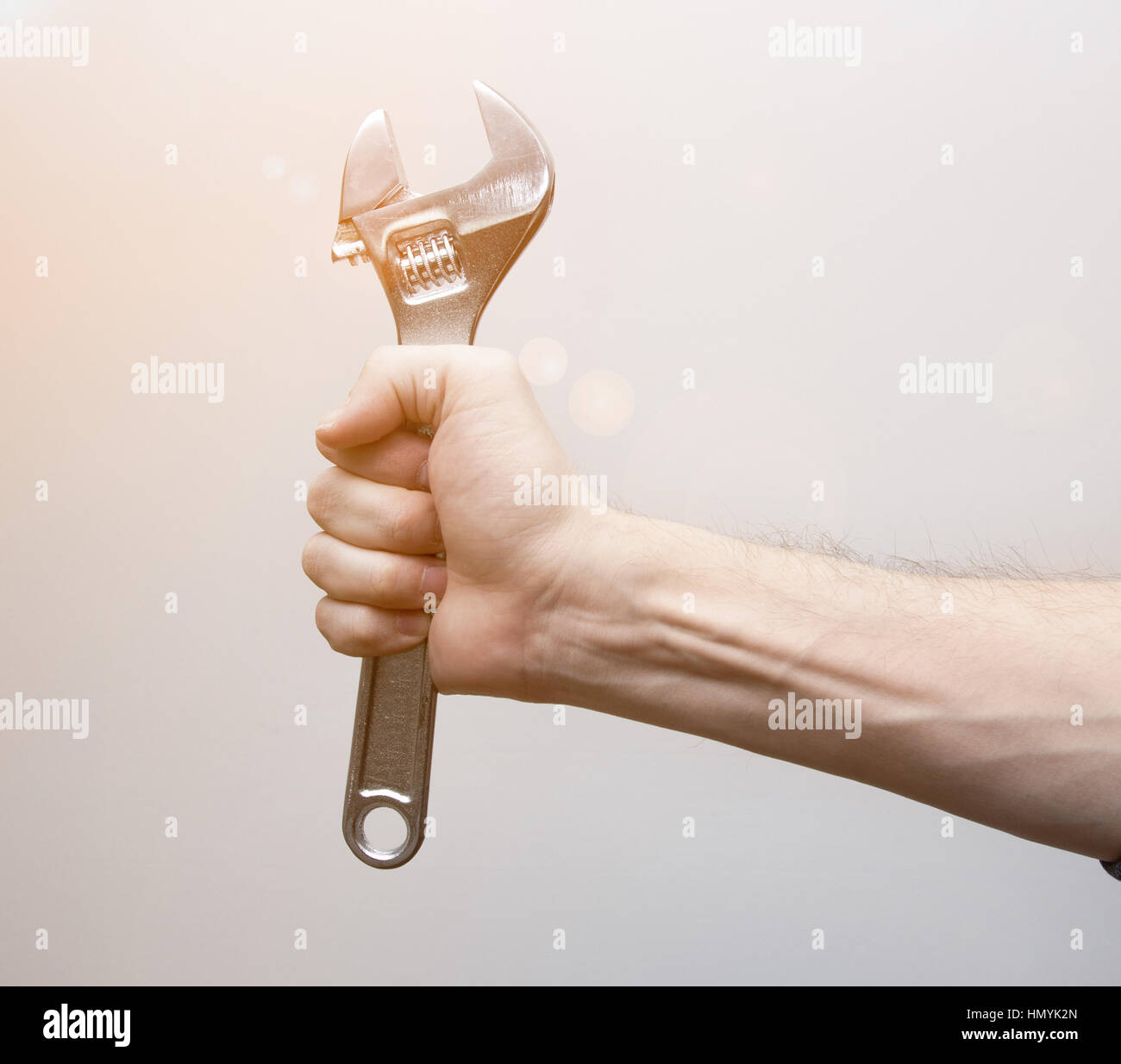 adjustable wrench in worker hand Stock Photo - Alamy