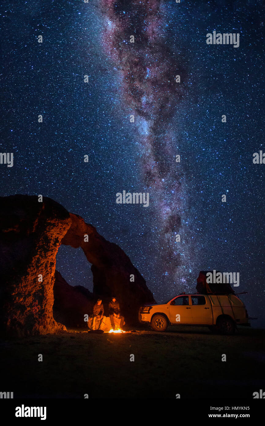 Camping under a rock arch Stock Photo - Alamy