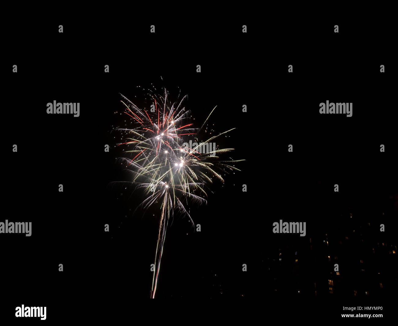 Start of a colorful firework on the dark night sky Stock Photo - Alamy