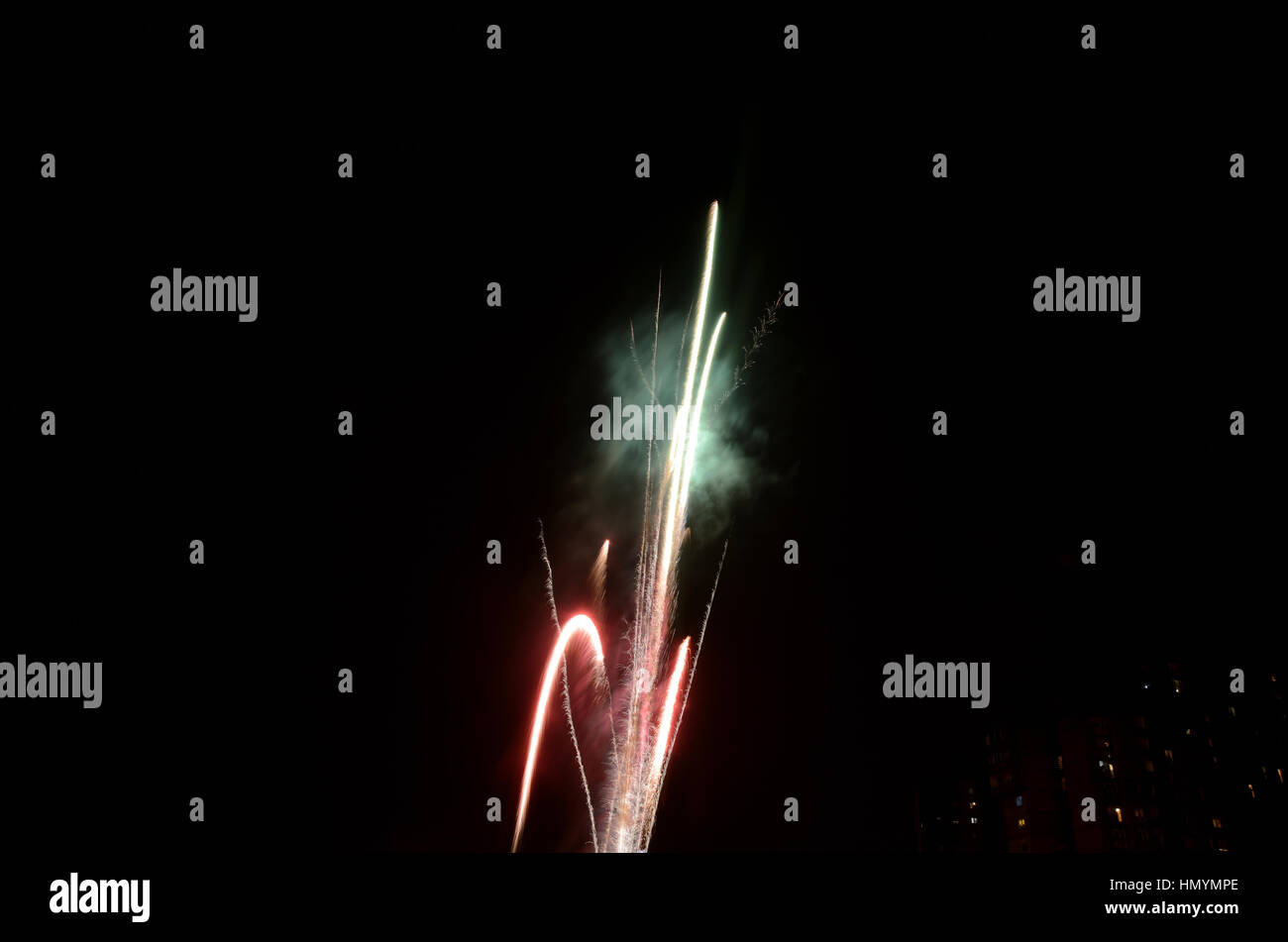 Firework rocket exploding on the dark night sky Stock Photo - Alamy