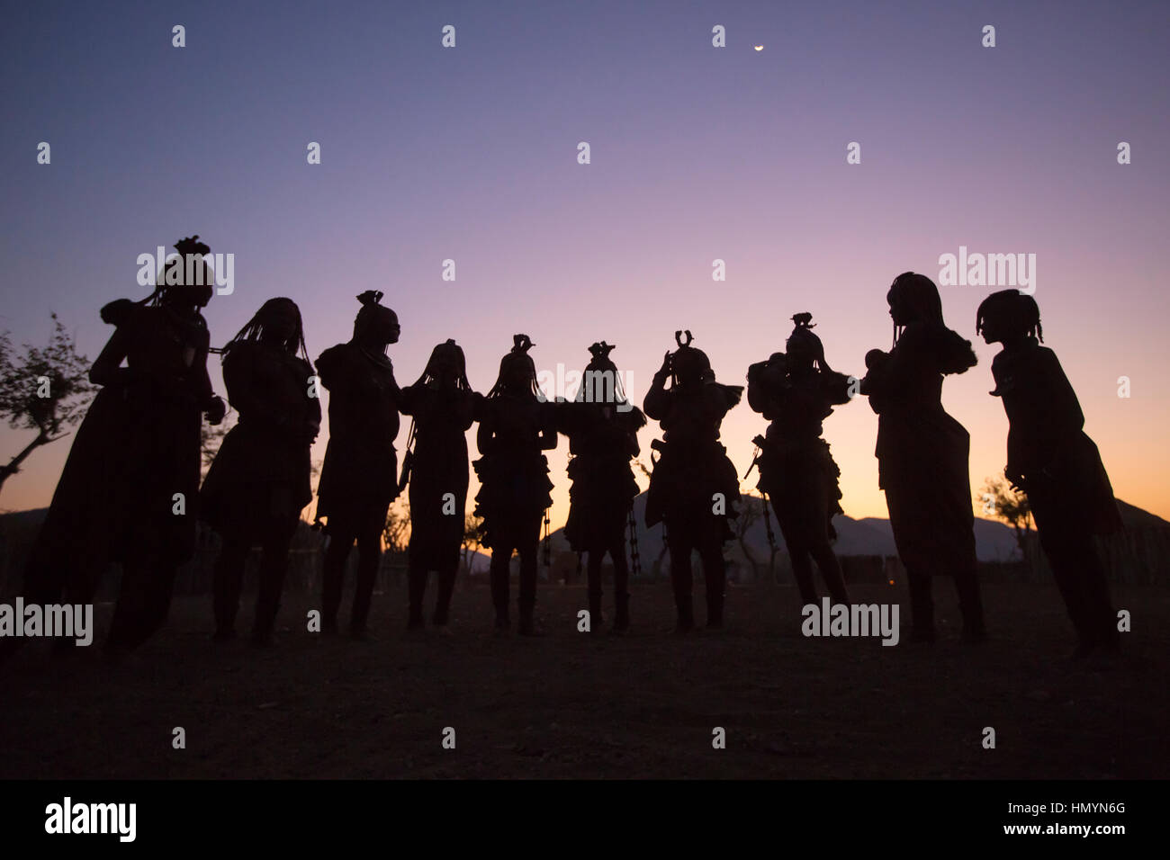 Himba villagers dance at dusk in Namibia Stock Photo - Alamy