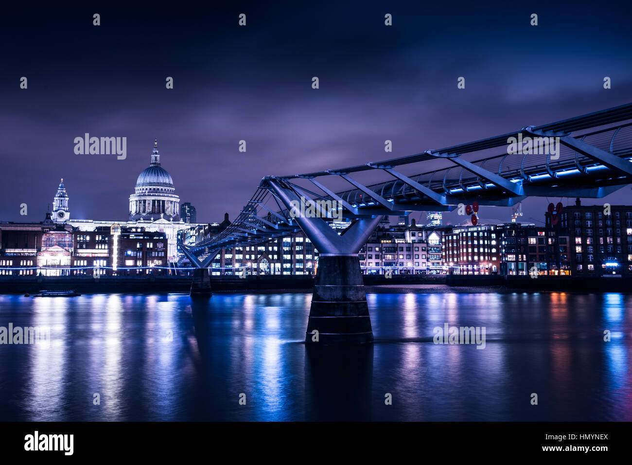 Millennium Bridge in London by night Stock Photo - Alamy