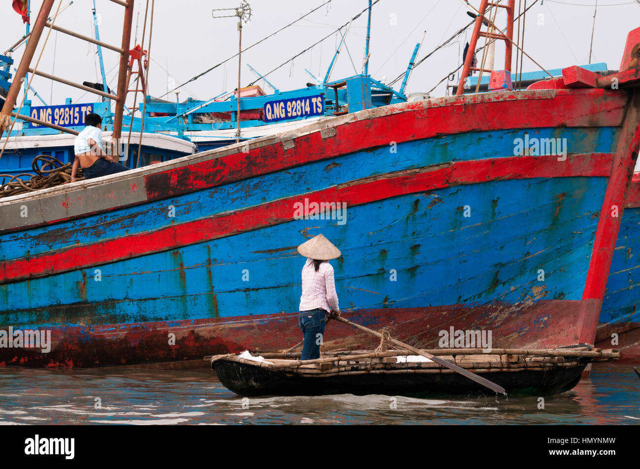 Vietnam. Cat Ba Bay. Vietnamese in their boats Stock Photo - Alamy