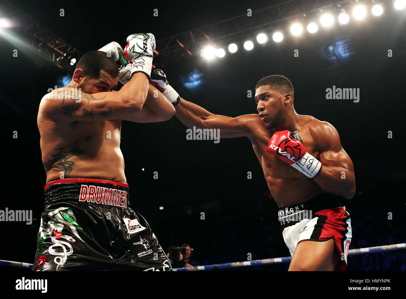 Anthony Joshua (right) and Eric Molina in action during their IBF World ...
