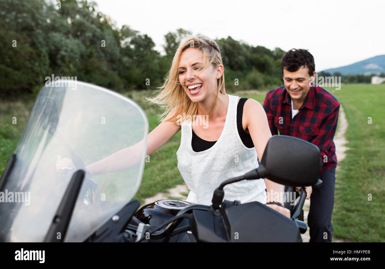 Couple in love enjoying a motorbike ride in countryside Stock Photo - Alamy