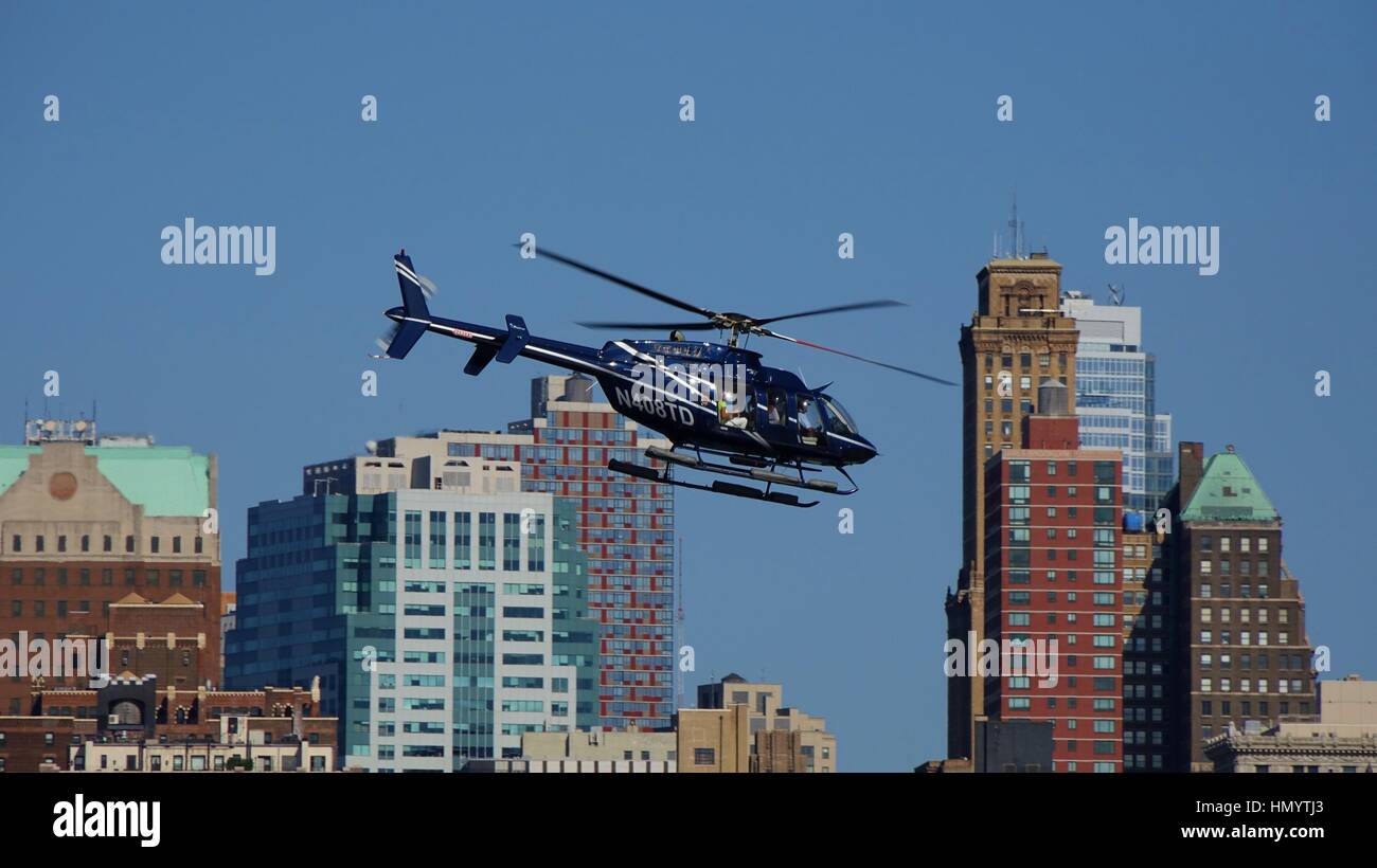 Helicopter And Urban Buildings Stock Photo - Alamy