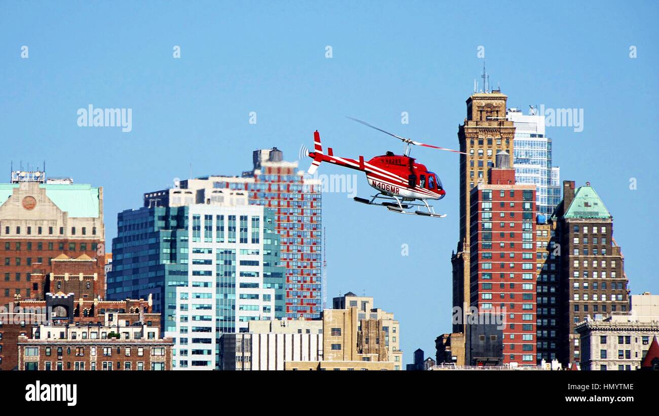 Helicopter Flight And City Buildings Stock Photo - Alamy