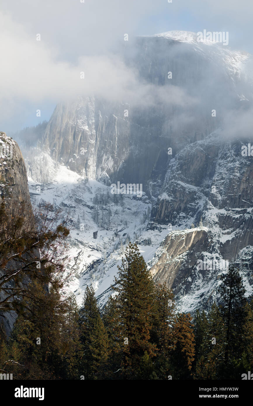 Half Dome with snow and clouds, California, Yosemite National Park ...