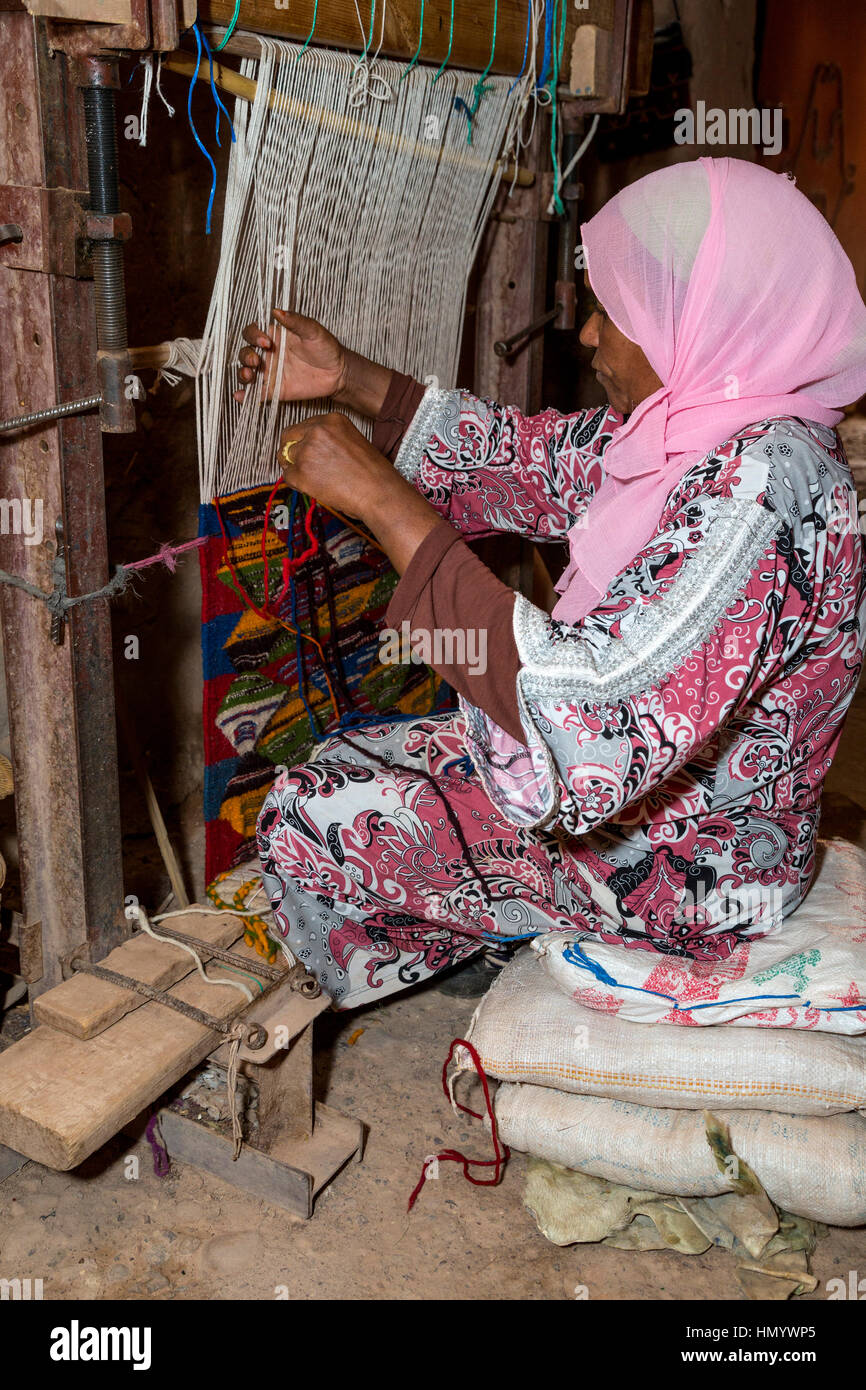 Morocco. Berber Woman Weaving a Rug in her Home. Ait Benhaddou Ksar, a ...