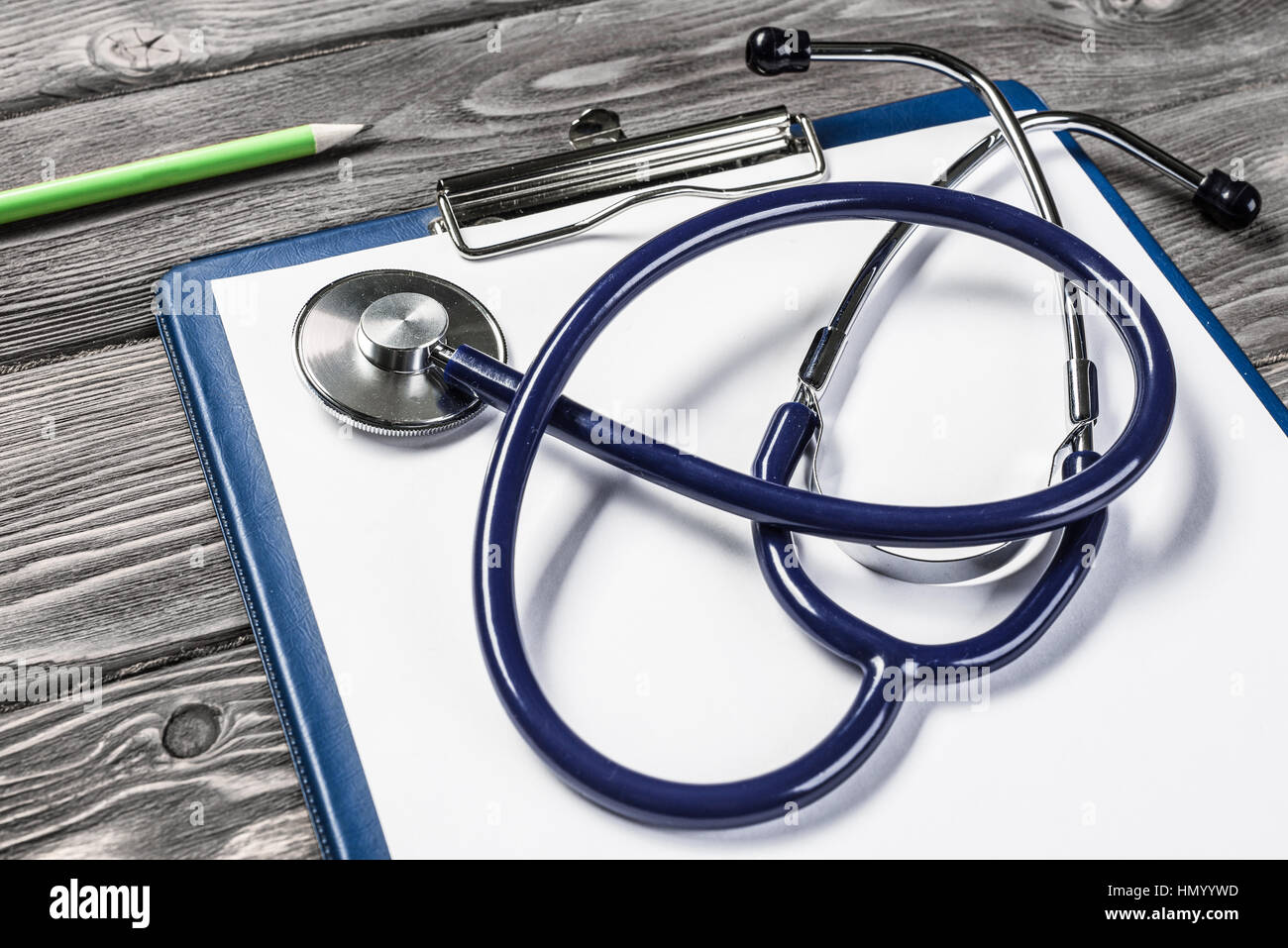 Doctors wooden table with tablet stethoscope and other stuff Stock ...