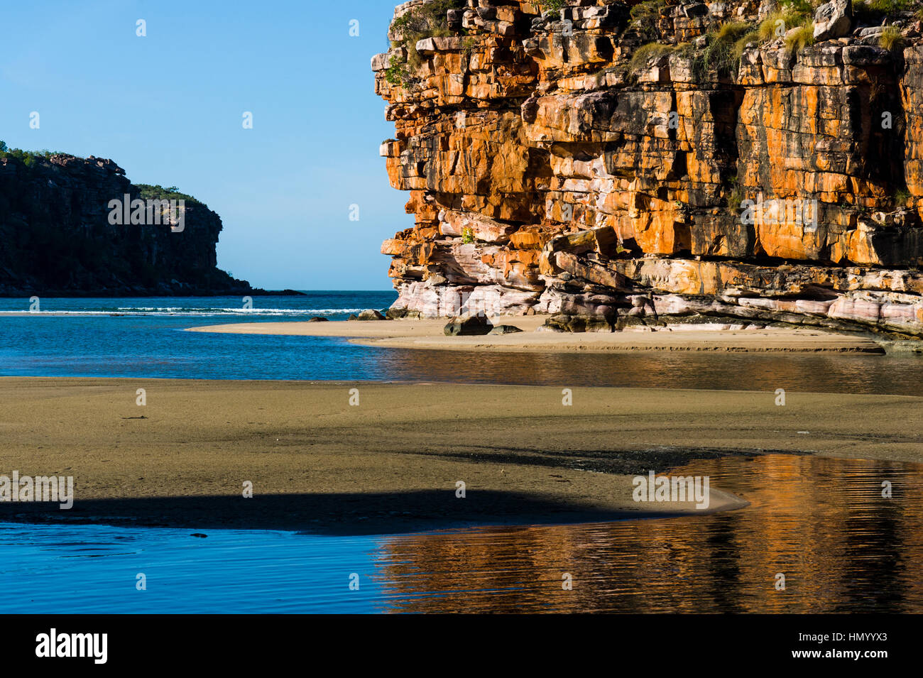 Sandstone cliffs on a remote and pristine coastal desert beach Stock ...