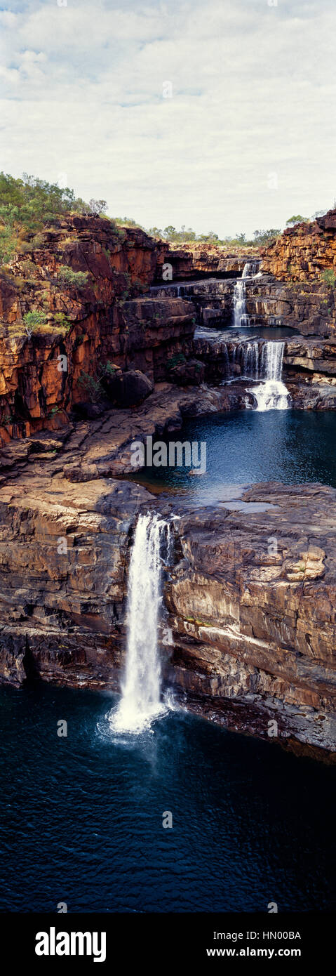 The magnificent Mitchell River cascades down ochre sandstone tiers in ...