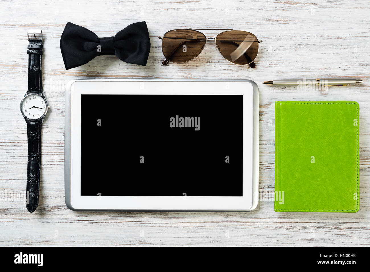 Men's accessories and tablet on white wooden surface Stock Photo - Alamy