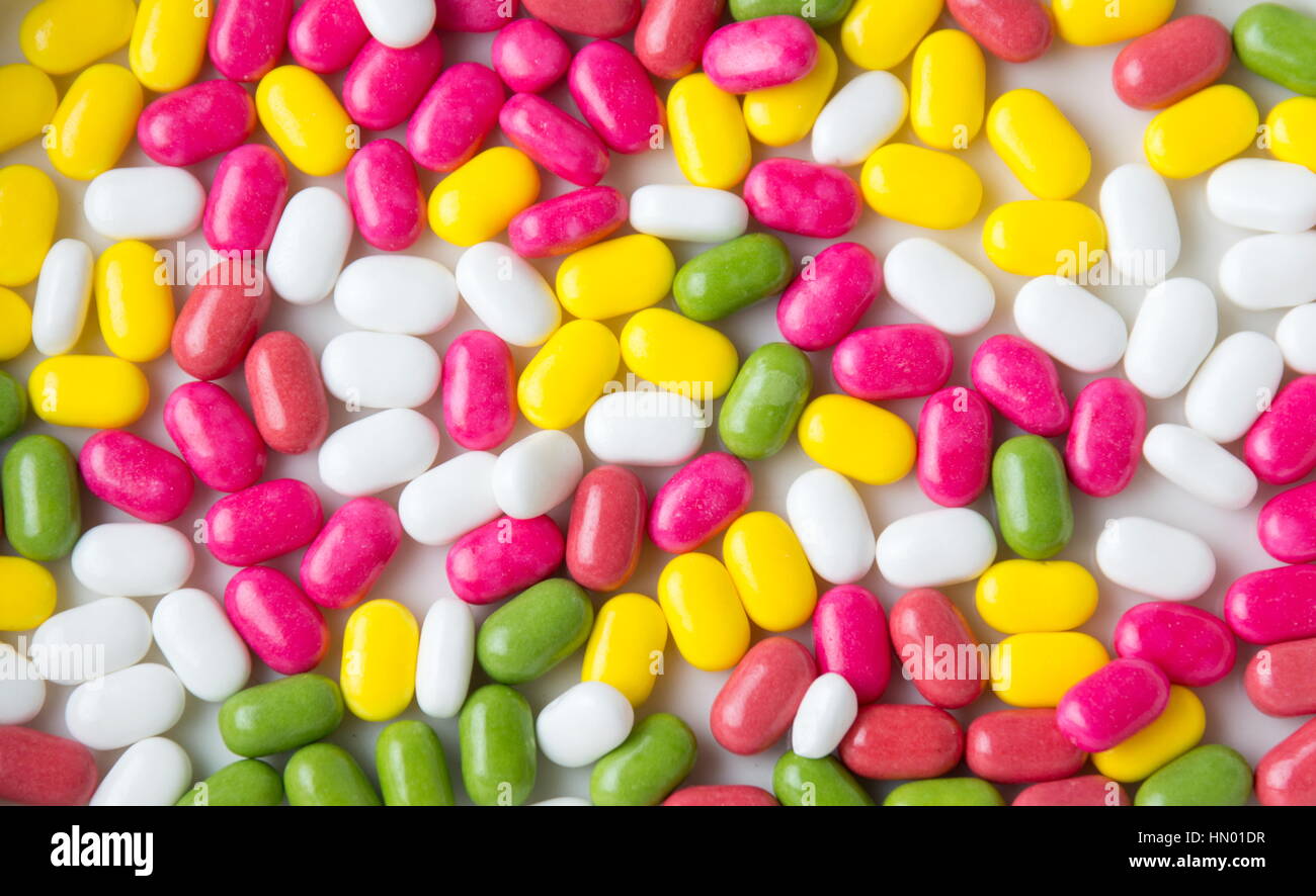 Colorful mints mix forming background pattern Stock Photo - Alamy