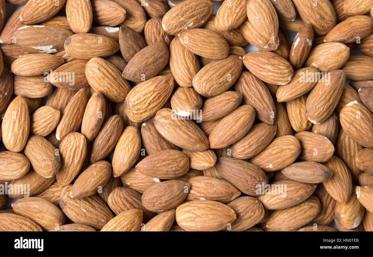 Fresh almonds background texture Stock Photo - Alamy