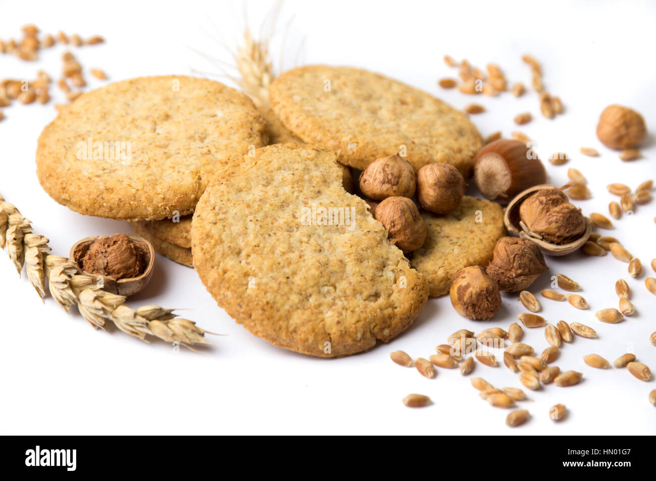 Integral cookies with hazelnuts and linseed on white background Stock ...