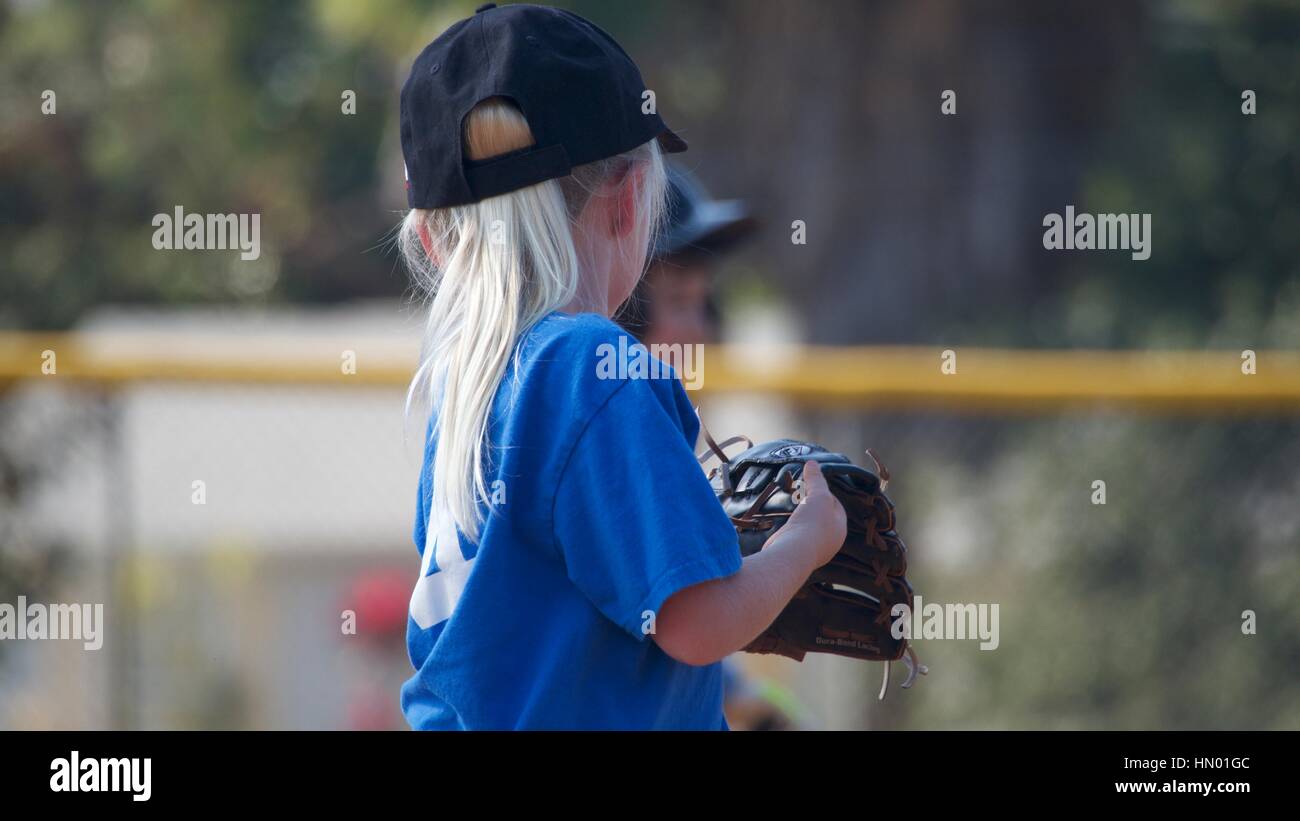 Young girl playing baseball Stock Photo - Alamy