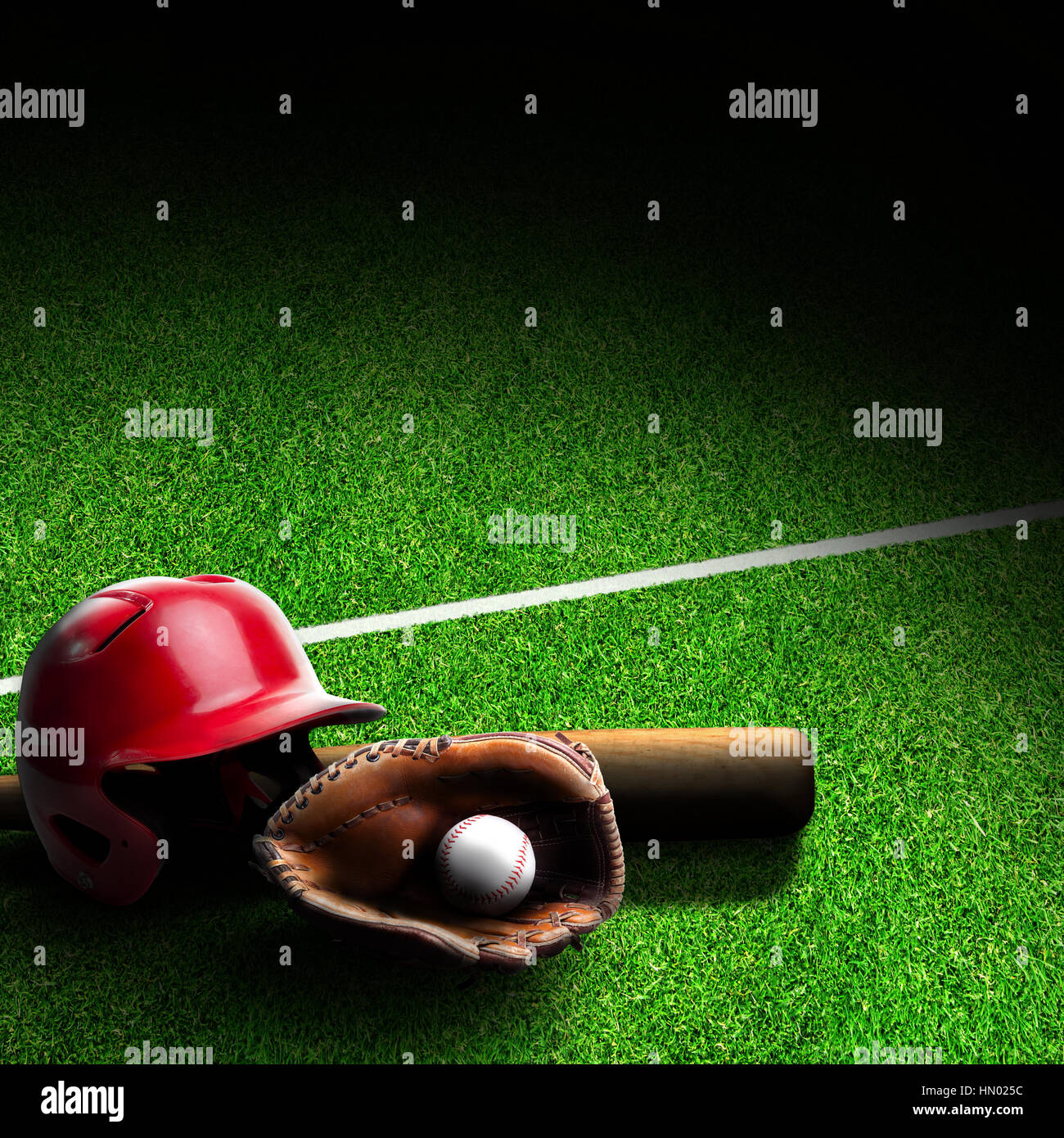 Baseball helmet, bat, glove and ball on grass field with marking ...