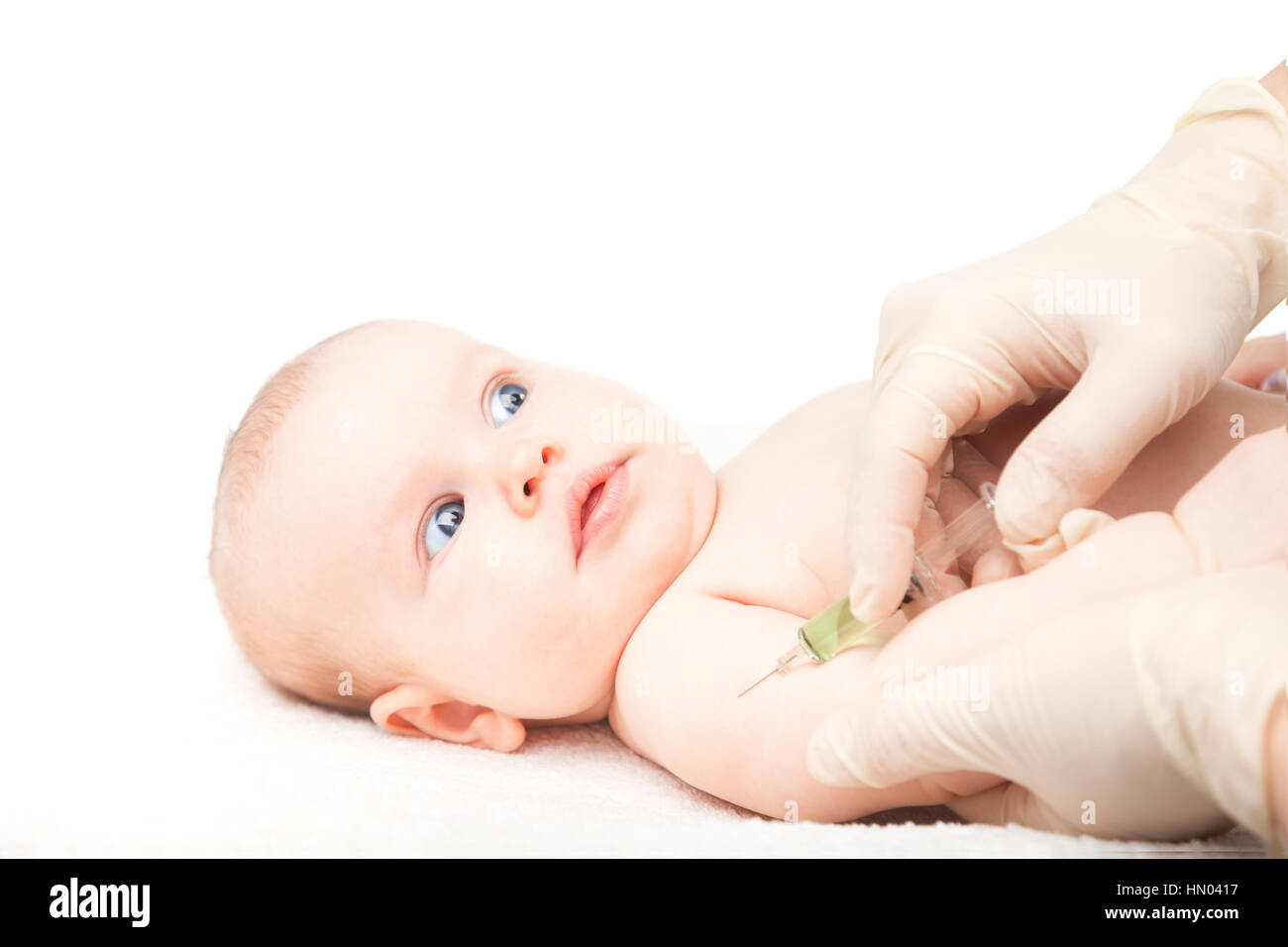 Pediatrician giving a three month baby girl intramuscular injection in ...