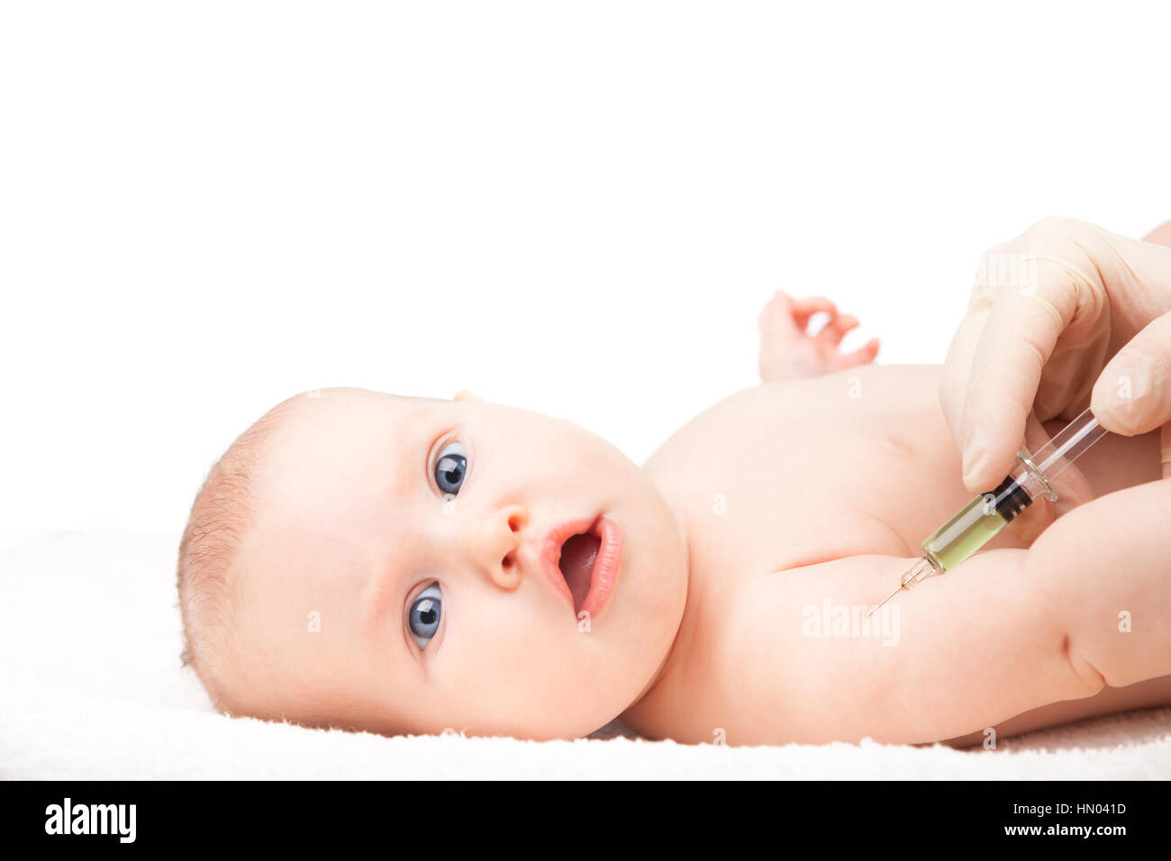 Pediatrician giving a three month baby girl intramuscular injection in ...