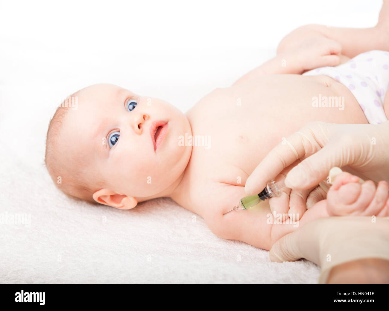 Pediatrician giving baby girl vaccination hi-res stock photography and ...
