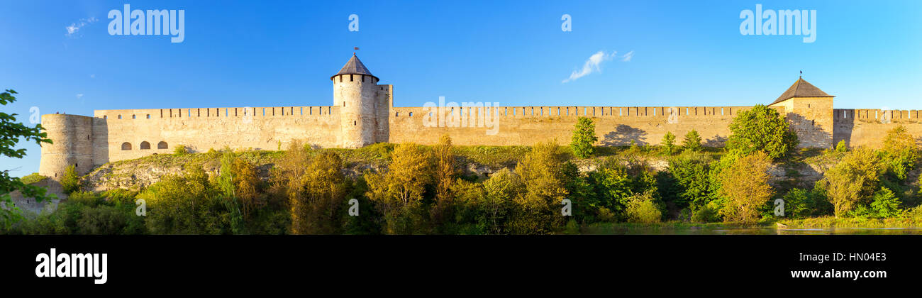 Ivangorod fortress stand on banks of Narva river. Medieval ...