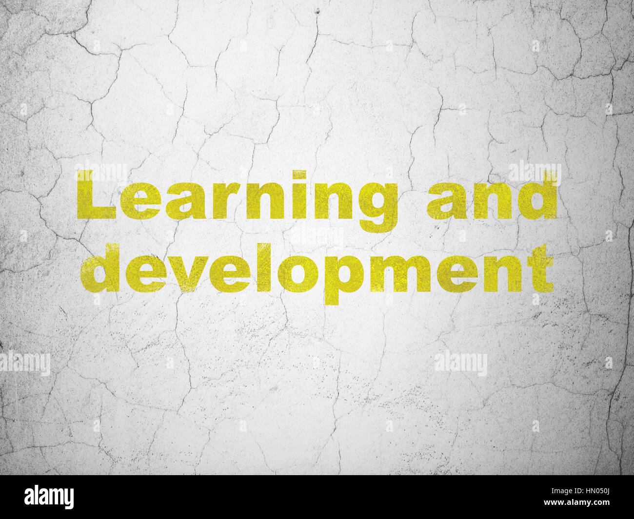Learning concept: Yellow Learning And Development on textured concrete ...
