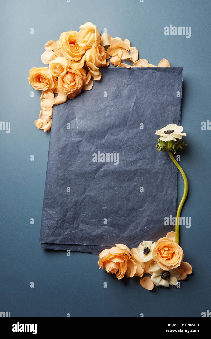 Retro frame with orange flowers and black paper with space for your ...