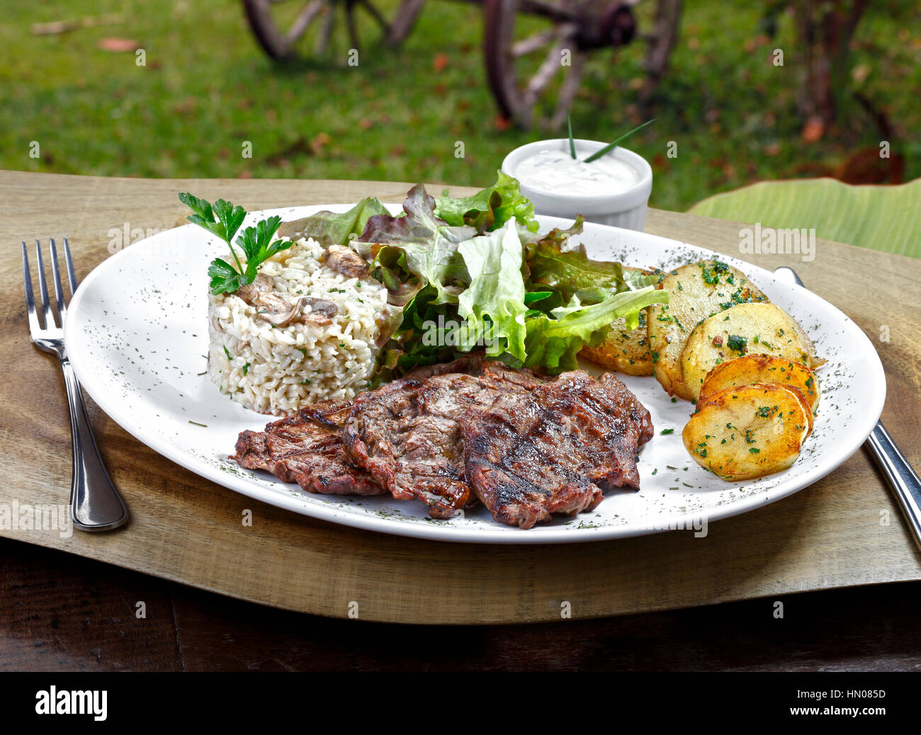 Rice with potatoes and meat Stock Photo - Alamy